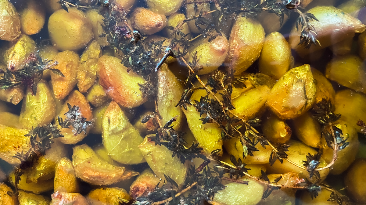 World's best kept secret: Garlic confit with extra virgin olive oil ...